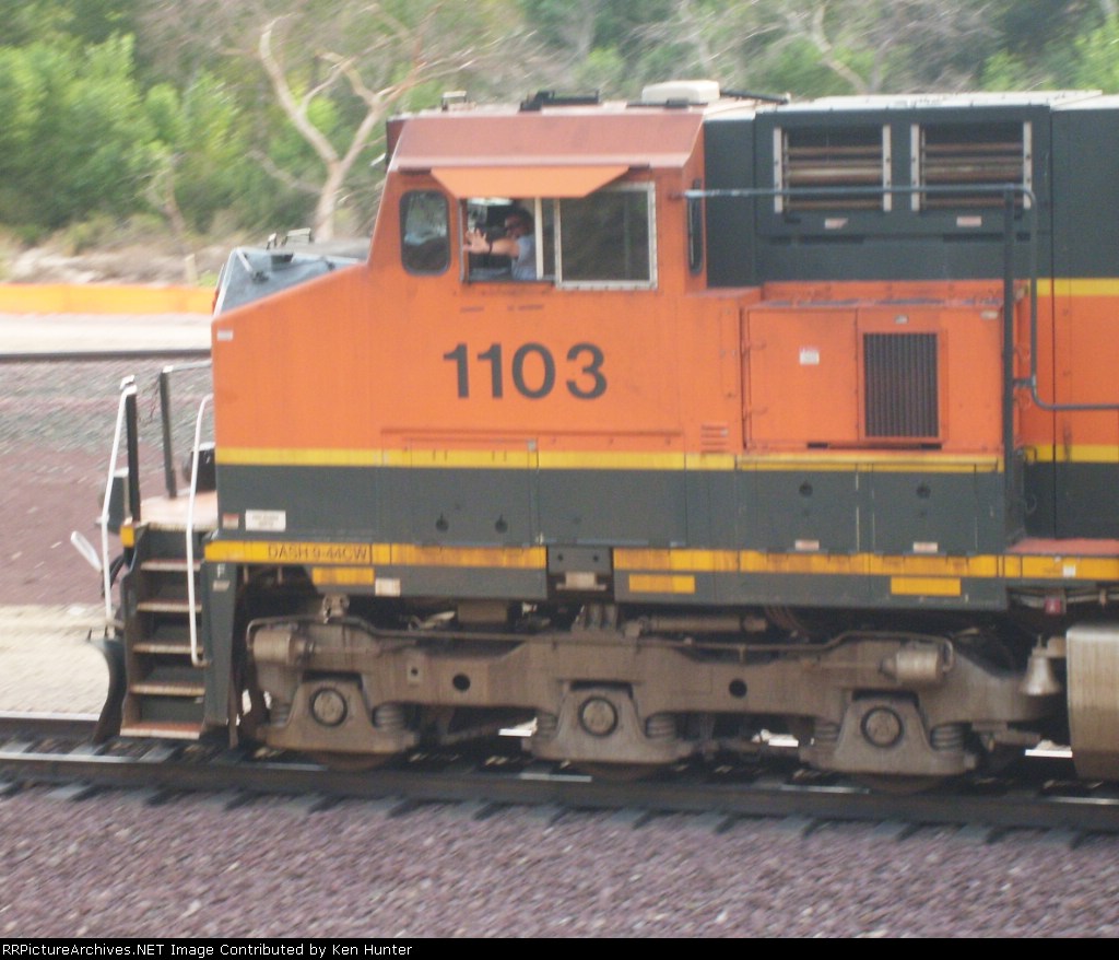 BNSF #1103 with the conductor waving